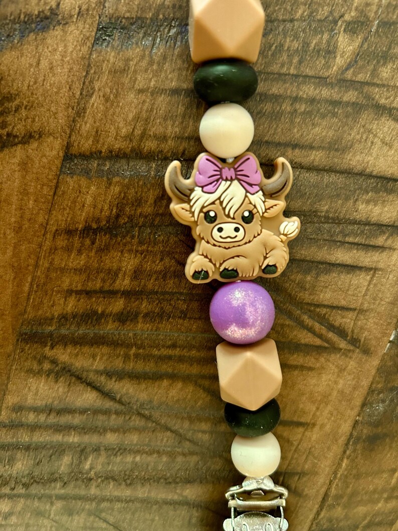 HIGHLAND Cow, Baby Girl Pacifier Clip, Purple Bow Neutral Accessory ...