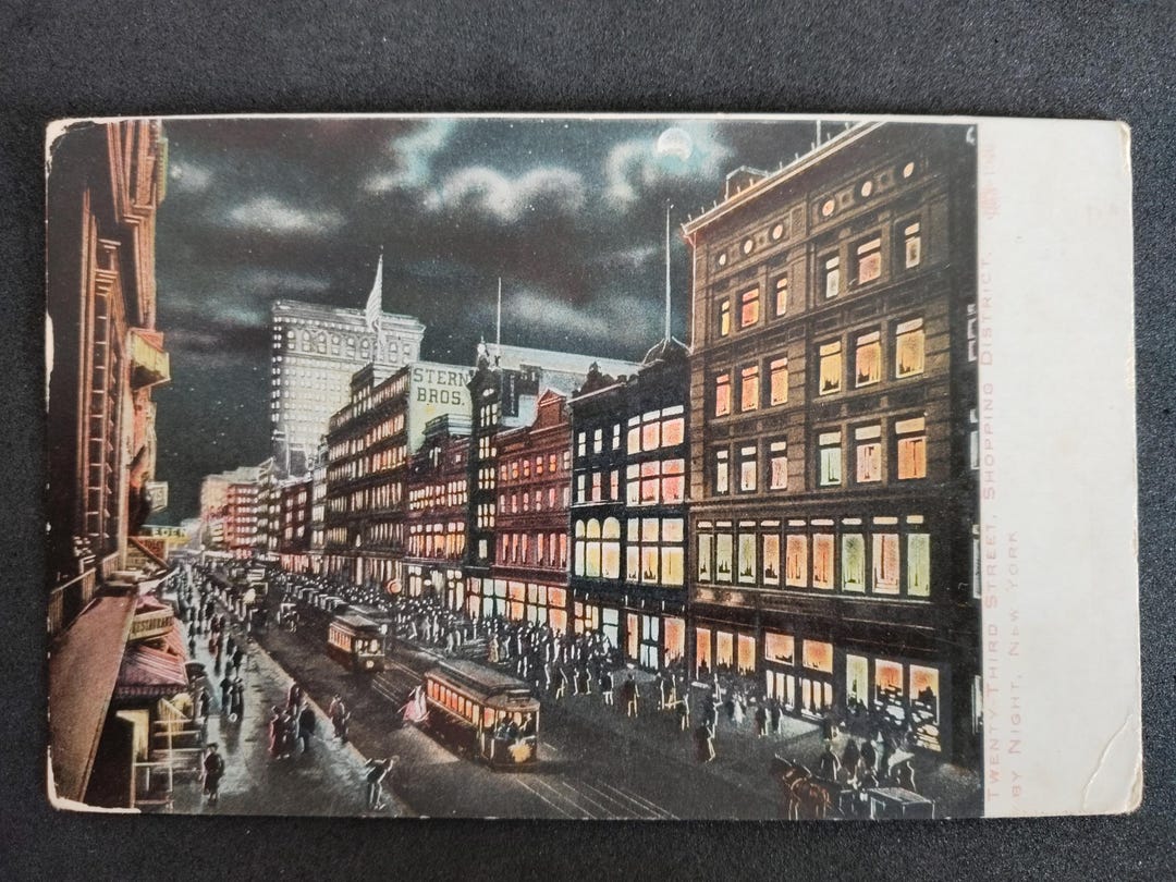 Открытка США. Twenty Third Street, Shopping District by Night, New York ...