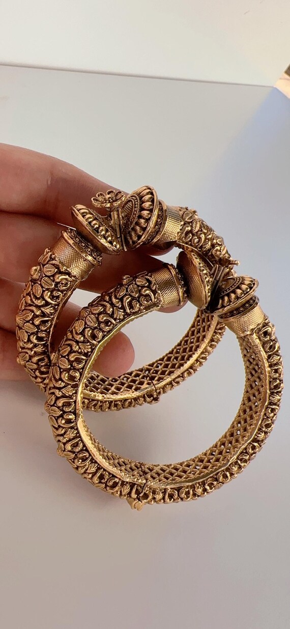 Gold bangles design antique store