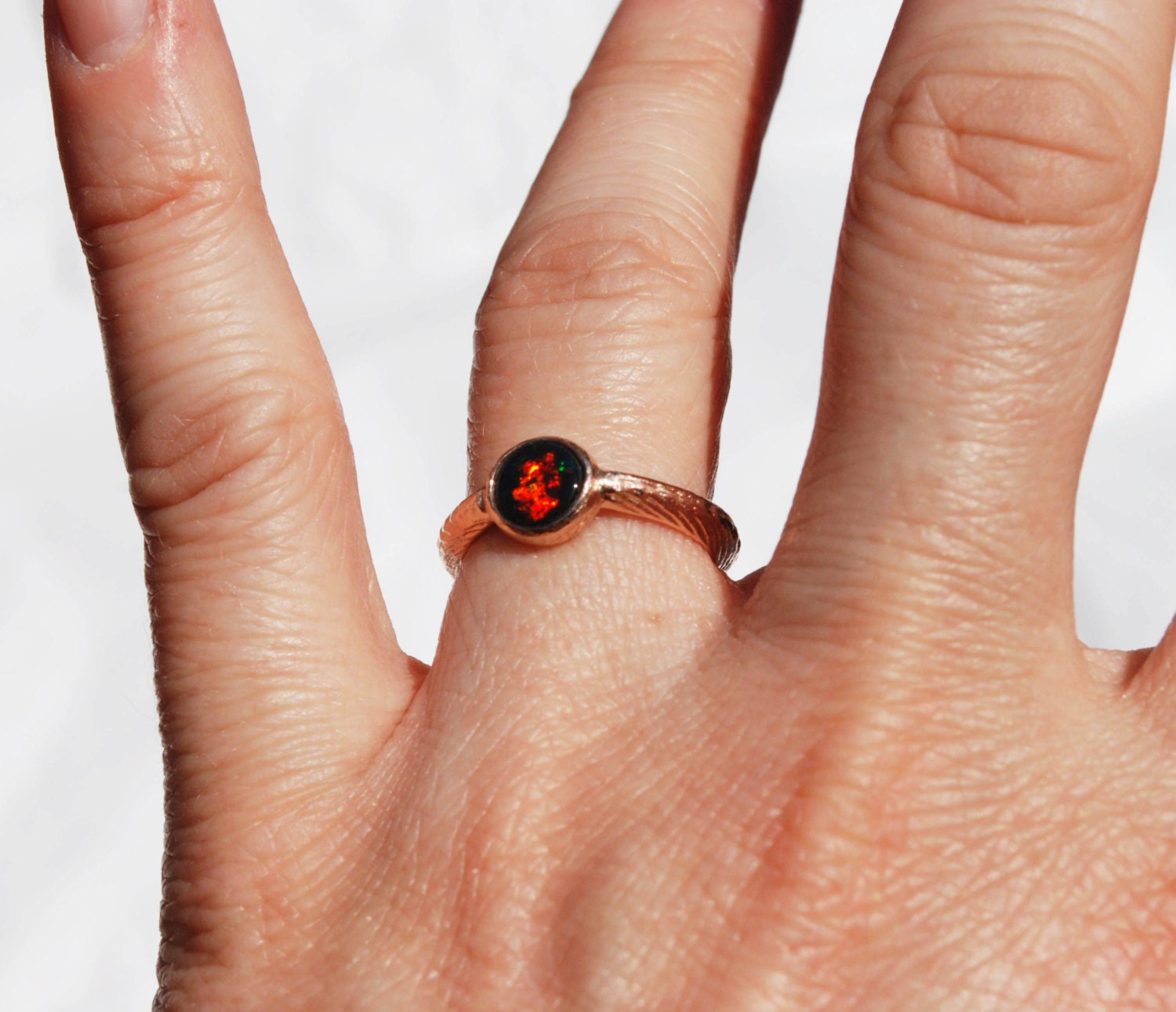 Solid Rose Gold Cuttlefish Cast and Black Opal Solitaire Ring