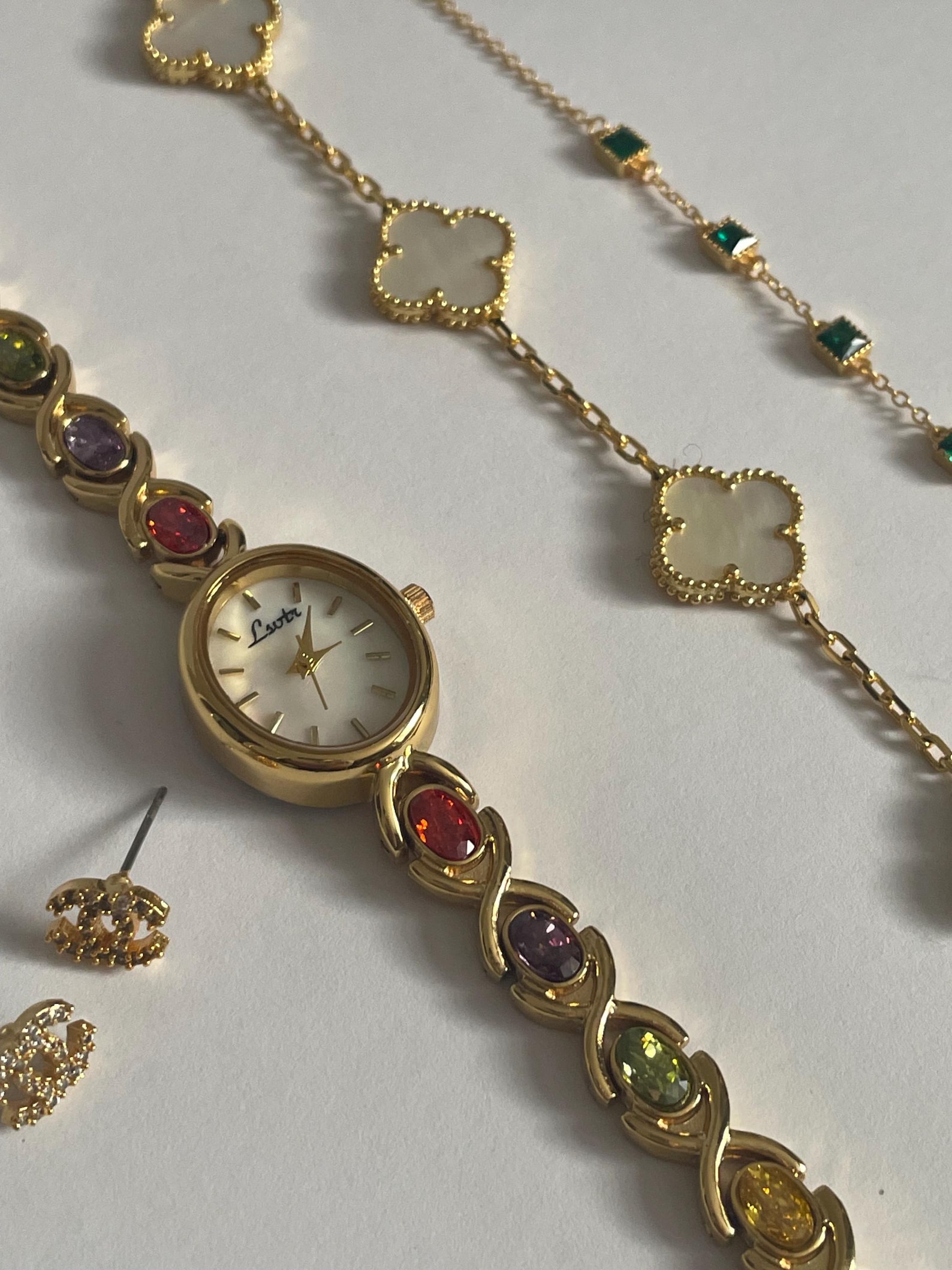 Elegant Gold Watch With Colourful Gem Accents and a Handmade Charm ...