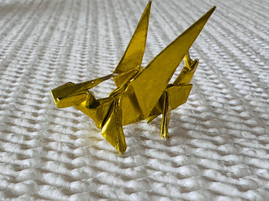 Miniature Mastery – A Tiny Origami Dinosaur Crafted With Exceptional ...