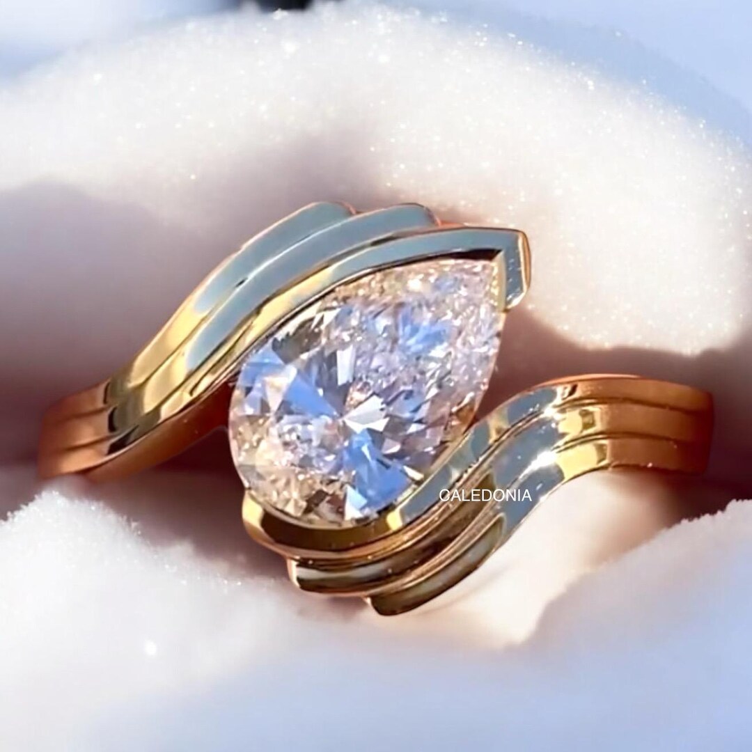 East West Pear Cut Moissanite Engagement Ring Curved Band Half Bezel ...