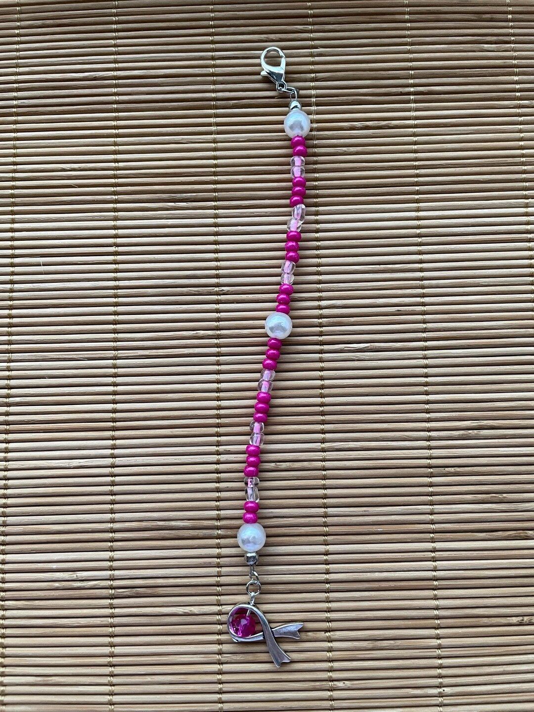 Dangle Using Pink and Pearly Glass Beads Ending With a Ribbon Charm ...