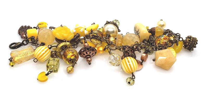 Yellow Charm Bracelet With a Mixture of Yellow Beads With Copper and ...