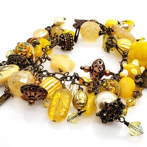 Yellow Charm Bracelet With a Mixture of Yellow Beads With Copper and ...