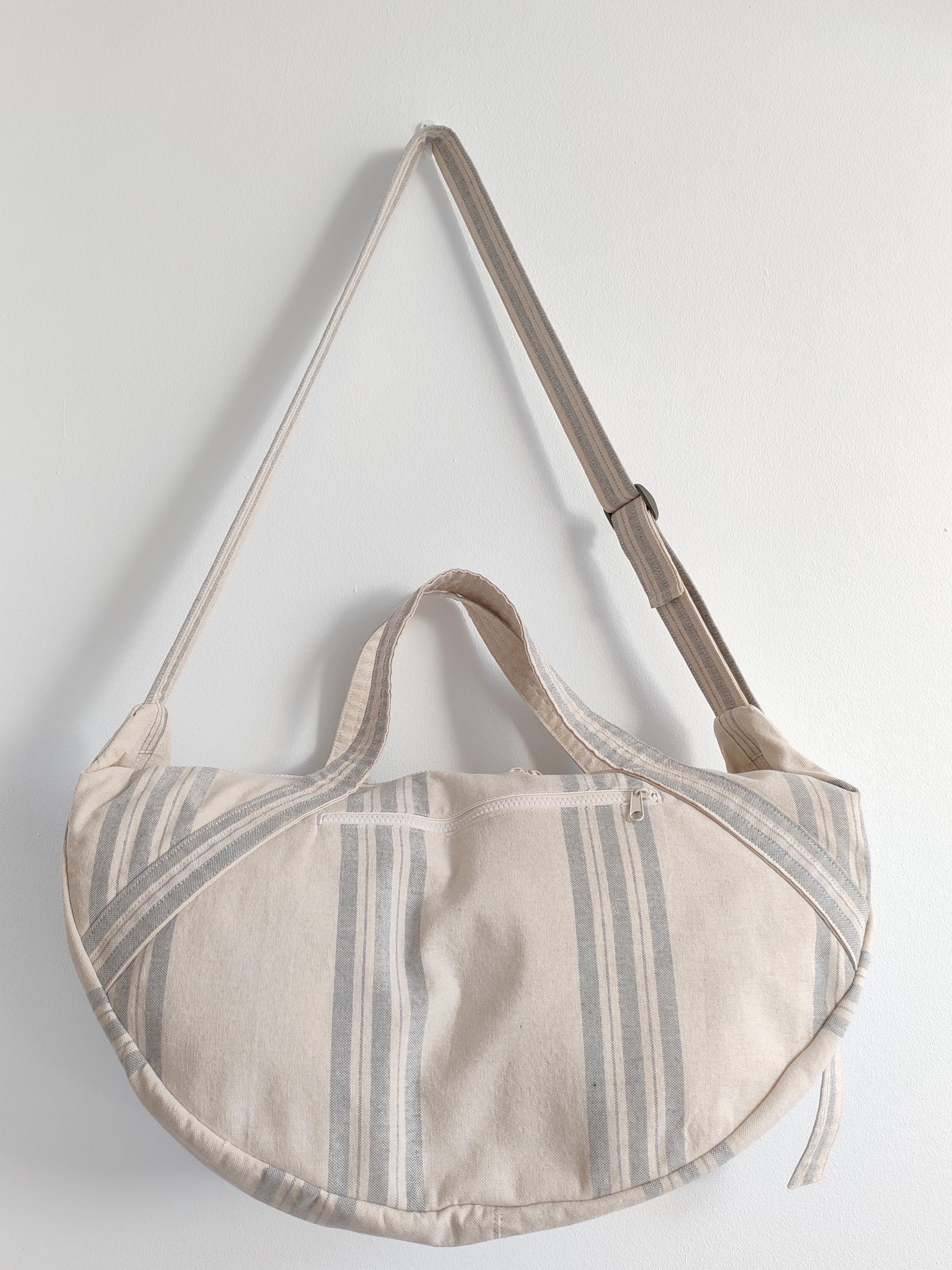 A Stylish Half Moon Bag, Designed for Versatility and Functionality. A ...