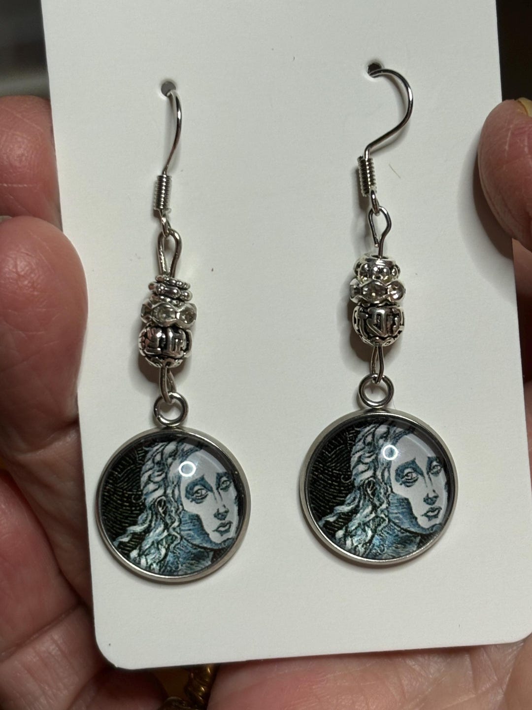 Round Shape With a Stylish Face and Silver Spacer Earrings With a ...