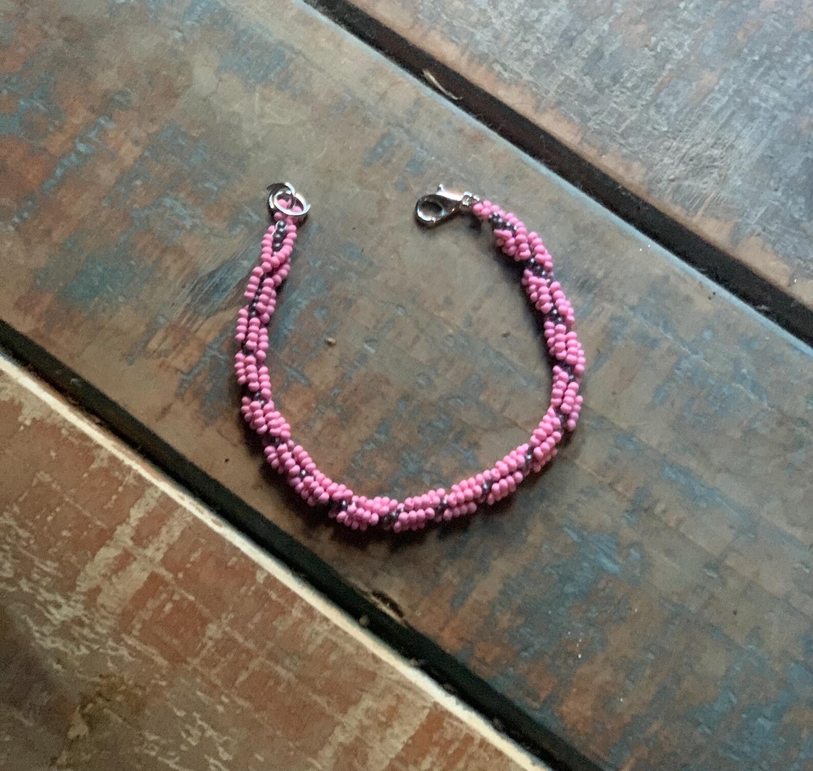 Handmade Twisted Beaded Rope Bracelet in Matt Pink With Gray Background ...