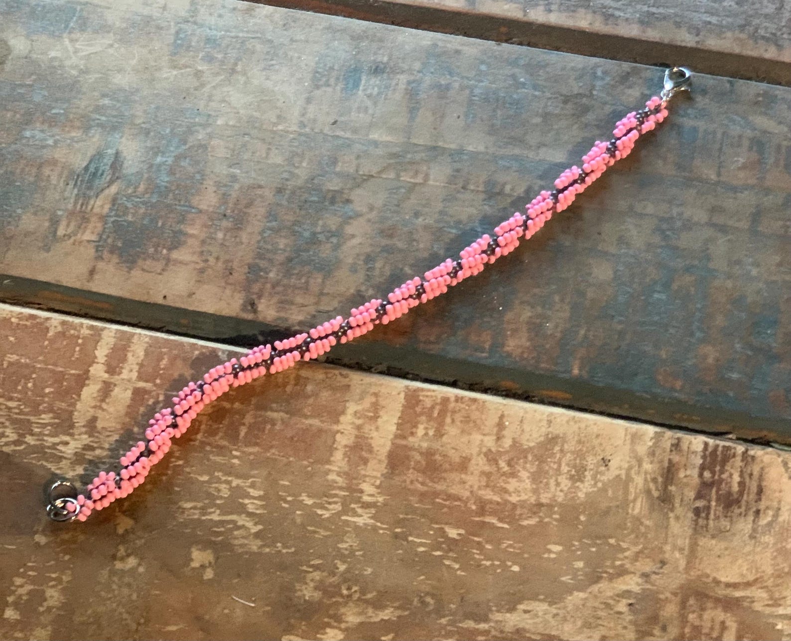 Handmade Twisted Beaded Rope Bracelet in Matt Pink With Gray Background ...