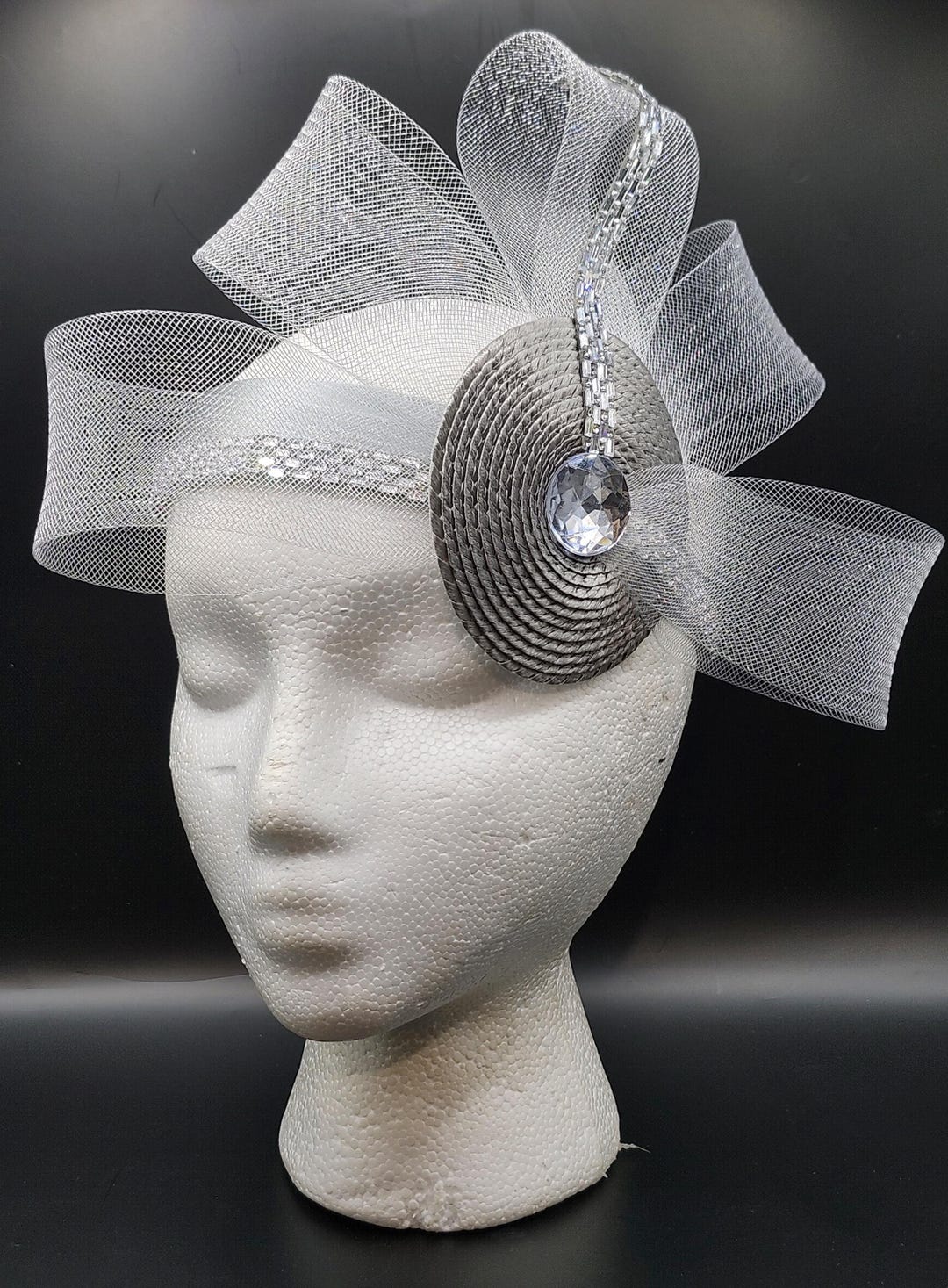 Fascinator A Silver Fascinator on a Satin Gray Headband With ...
