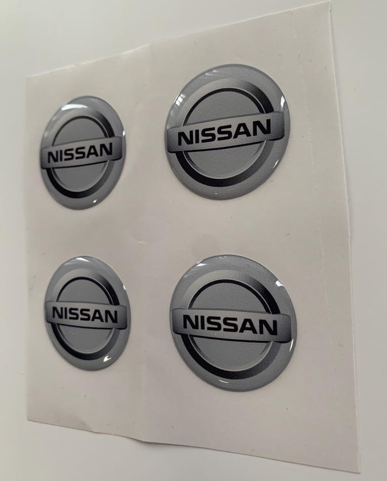 Excellent Quality / Set X 4 Self Adhesive Silicone Stickers Logo Nissan ...