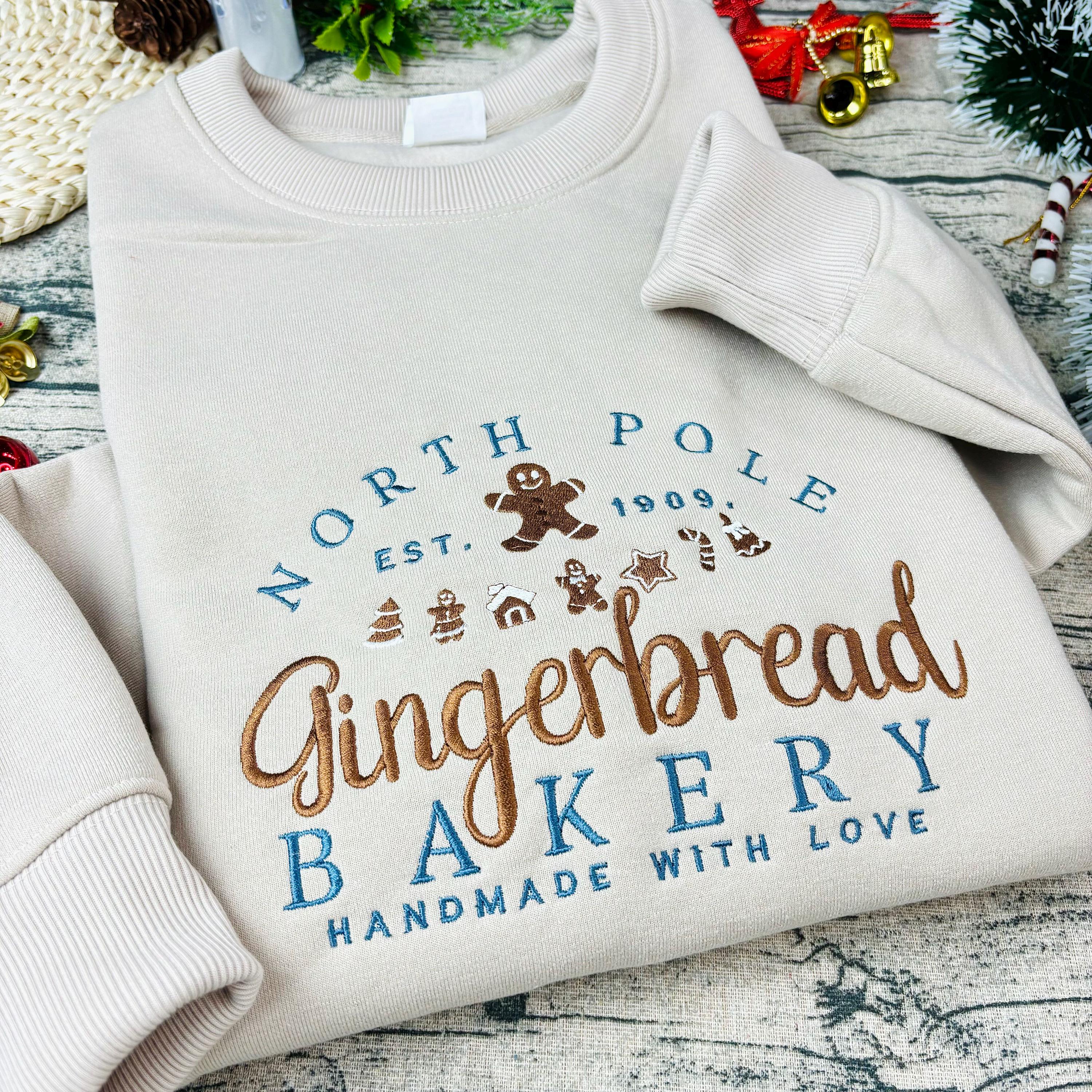 North Pole Gingerbread Bakery Embroidered Premium Sweatshirt, North ...