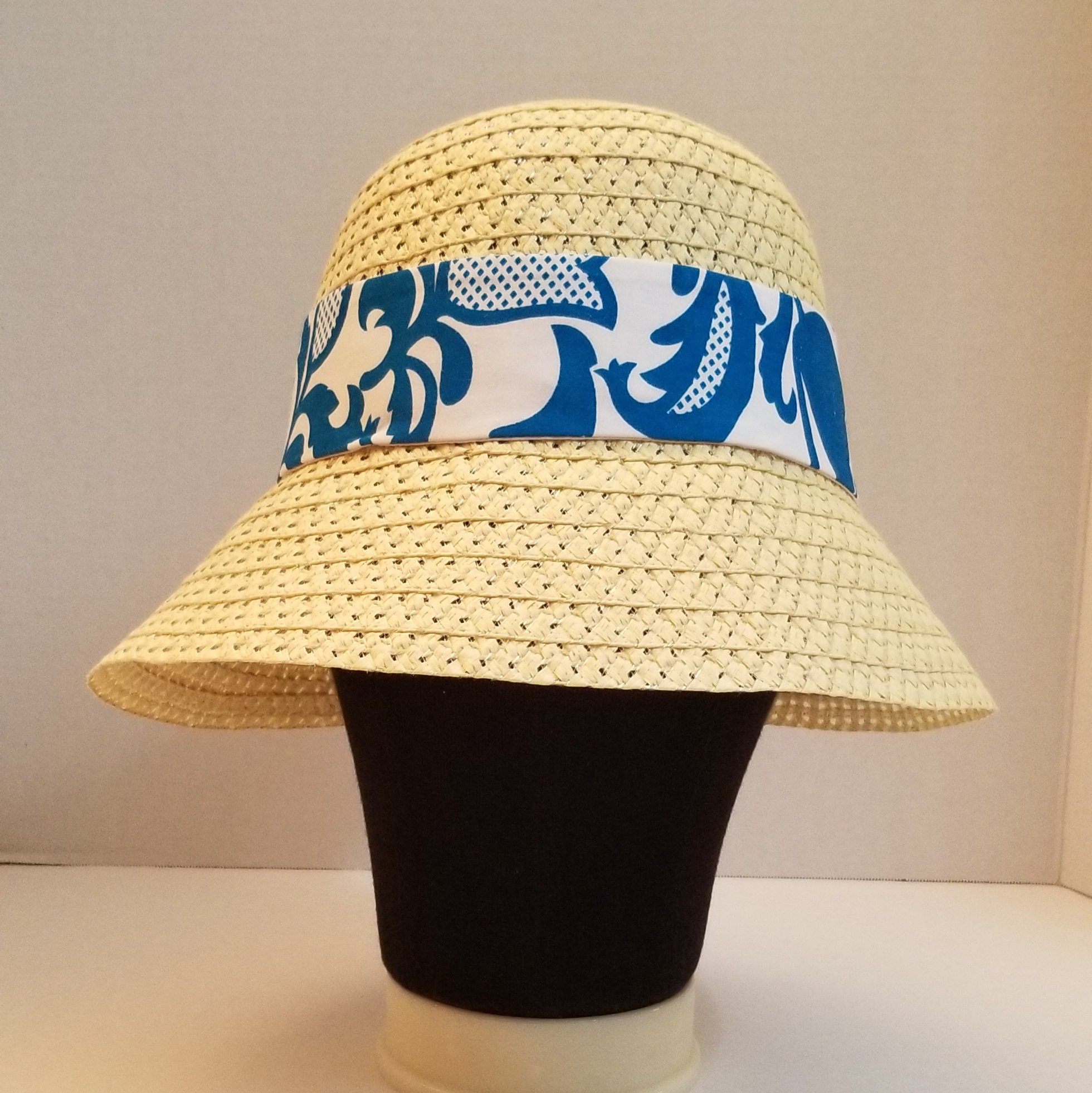 Natural straw hat accented with pollera fabric, velvet ribbon, and silk ...