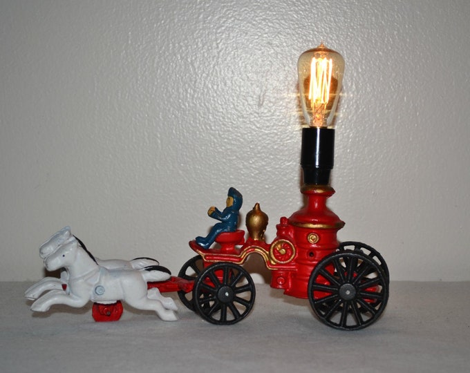 Unique Vintage Antique Cast Iron Firetruck With Removable Fireman and 2 ...