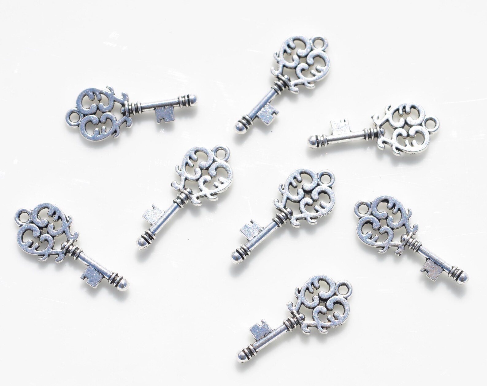 10 Small Skeleton Key Silver Tone Charms SC5437 | Etsy