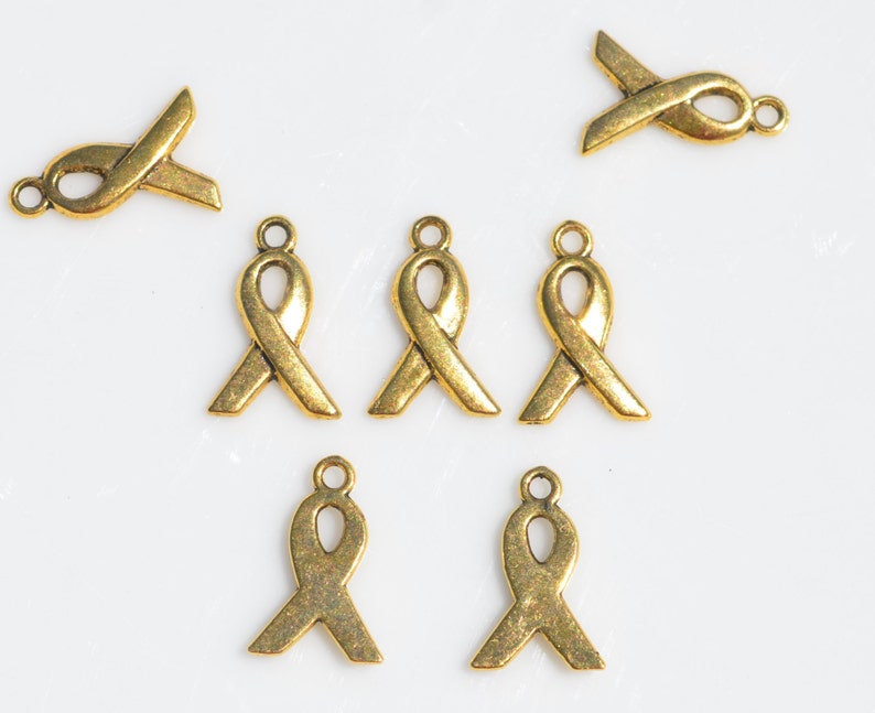 20 Cancer Awareness Gold Tone Ribbon Charms GC2360 - Etsy