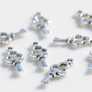 BULK 50 Tiny Key Silver Tone Charms SC5639 - Etsy