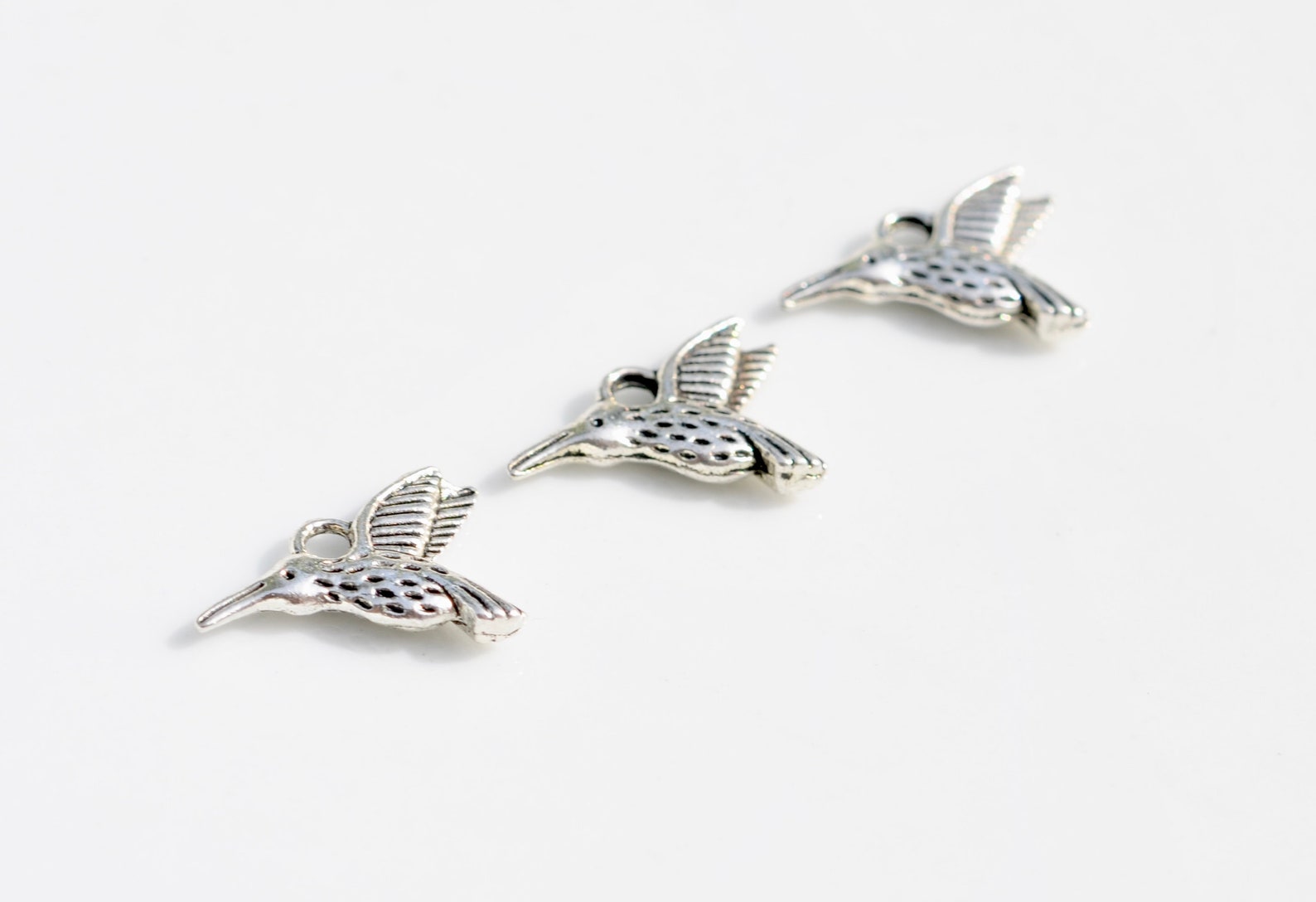 BULK 50 Hummingbird Silver Tone Charms SC1421 - Etsy