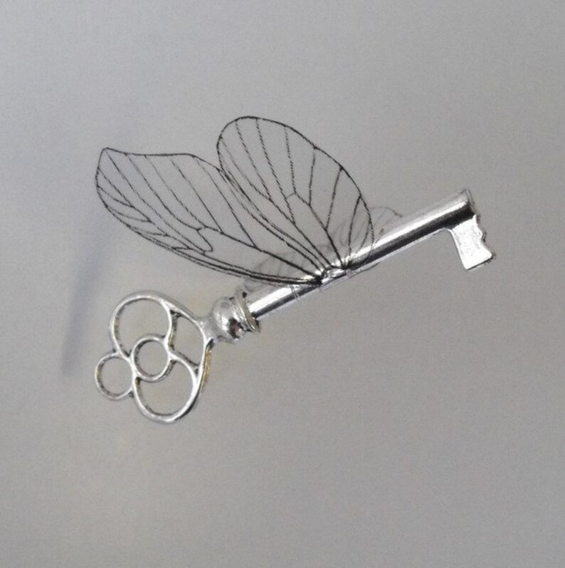 Flying Key With Small Reversed Butterfly Wings in Shiny Silver ...