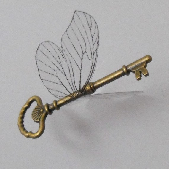 Flying winged key with small butterfly wings in antique brass | Etsy