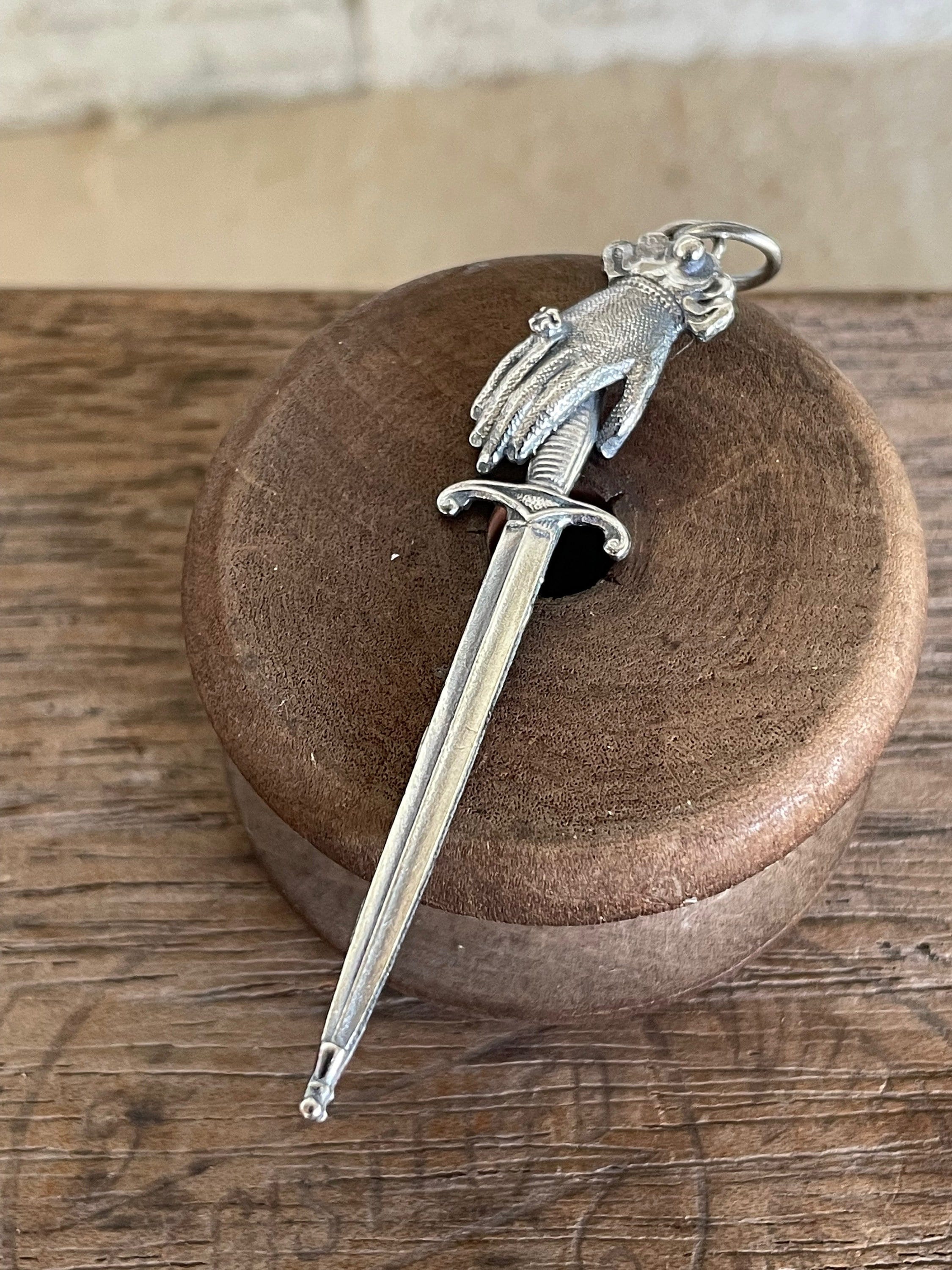Hand Holding Sword