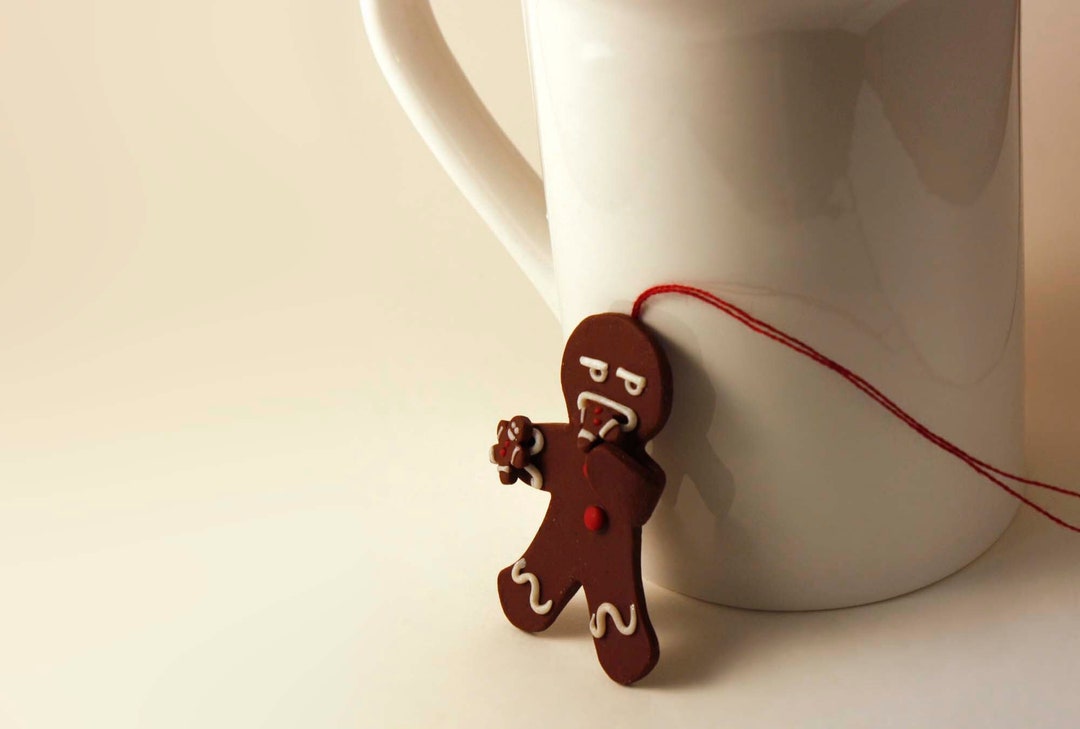 A Gingerbread Man Eating Smaller Gingerbread Men Etsy a-gingerbread-man-eating-smaller-gingerbread-men-etsy