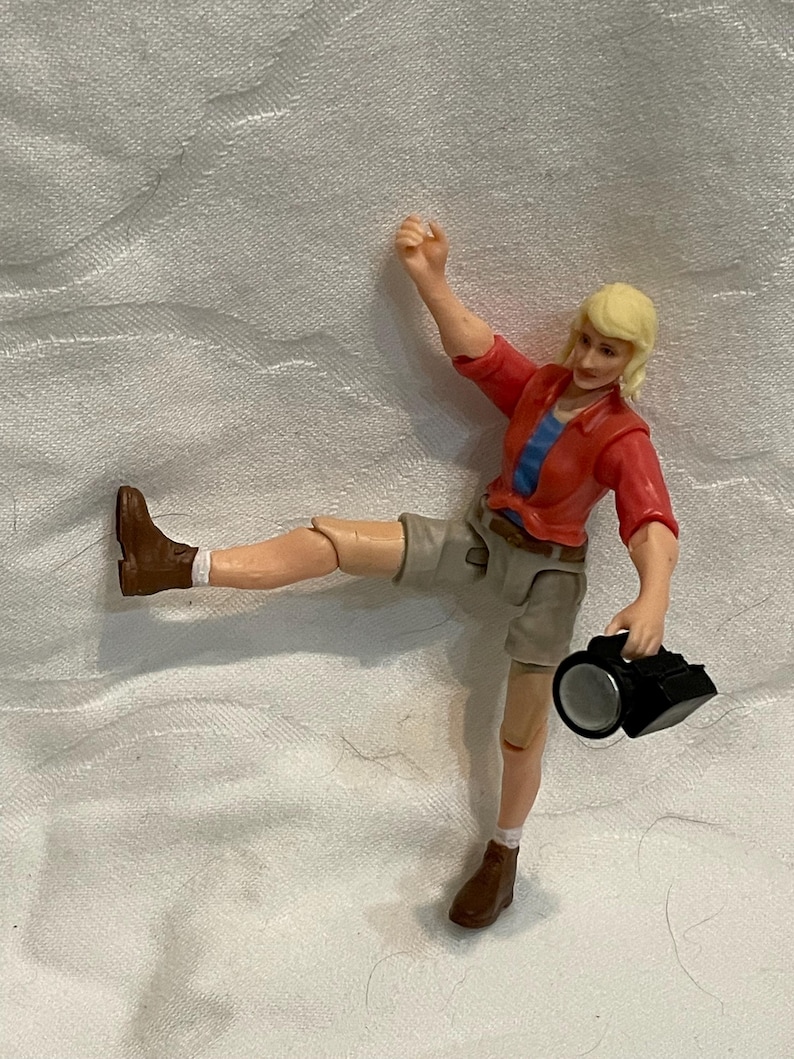 Jurassic Park Dr. Ellie Sattler With Flashlight and Small Dinosaur ...