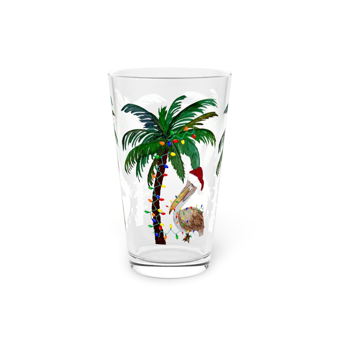 Pelican Christmas and Palm Tree Wrapped in Holiday Lightsl Beverage ...
