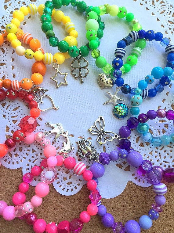 Set of 11 bracelets, mismatched rainbow bracelets, mix of charms ...
