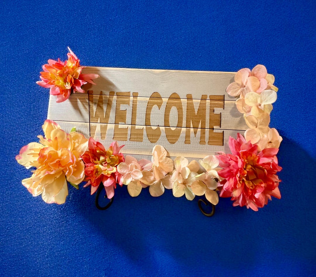 Engraved Welcome Sign With Pink and Peach Flowers on Weathered Planks ...