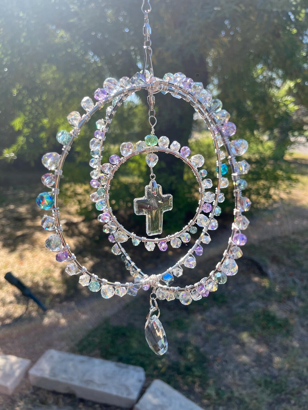 Spinning Sun Catcher With Acrylic Cross Captures the Sun's Brilliance ...