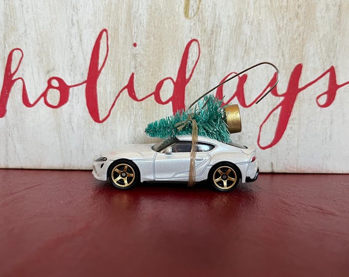 Toyota GR Supra Carrying Christmas Tree Ornament - Etsy