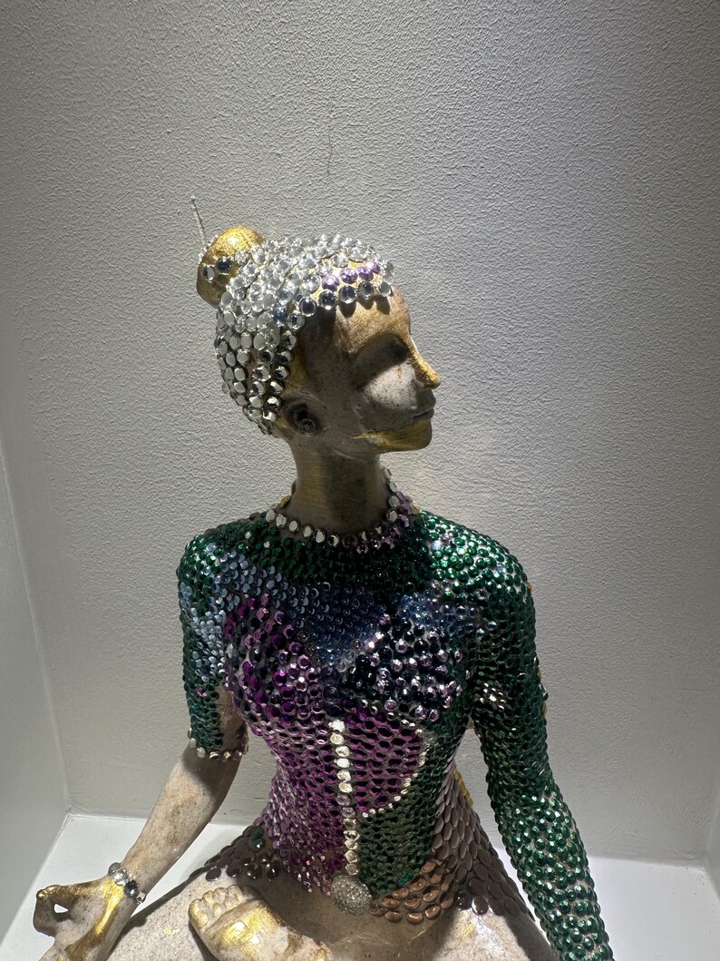 Bejeweled Lady Figurine Displaying Colorful Gems and Gold.reflecting ...