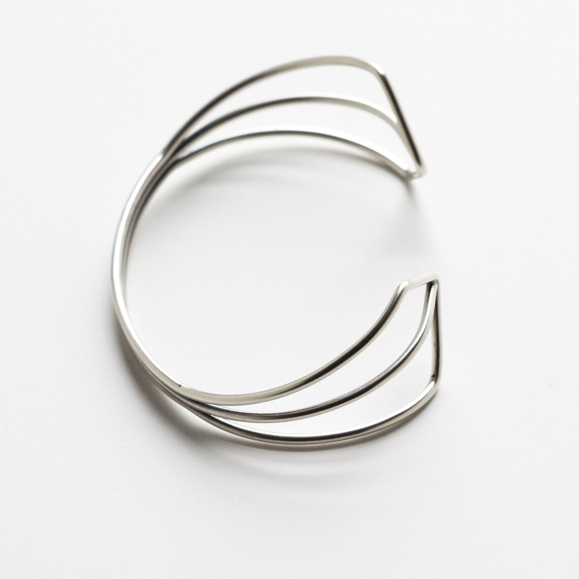 Geometric bracelet designed with angles and lines its open | Etsy