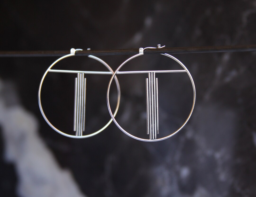 Geometric Hoop Art Deco Earring Design With Strong Vertical Lines as a ...