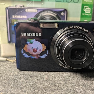 Samsung PL150 Dual Screen Digital Camera: 12MP Compact Point & Shoot ...