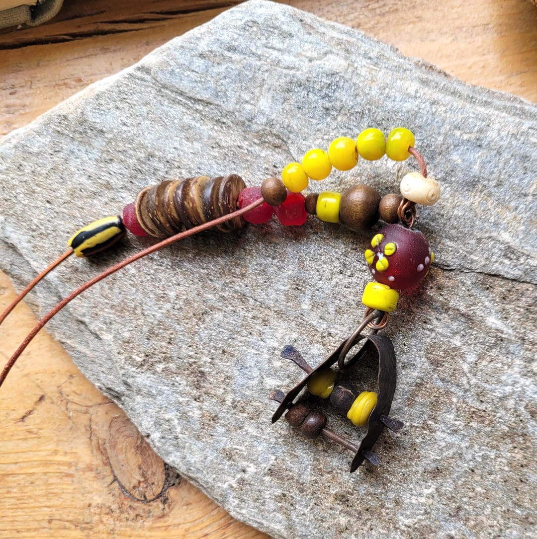 A Long Necklace on a Brown Leather Strap With a Hand-forged Copper ...