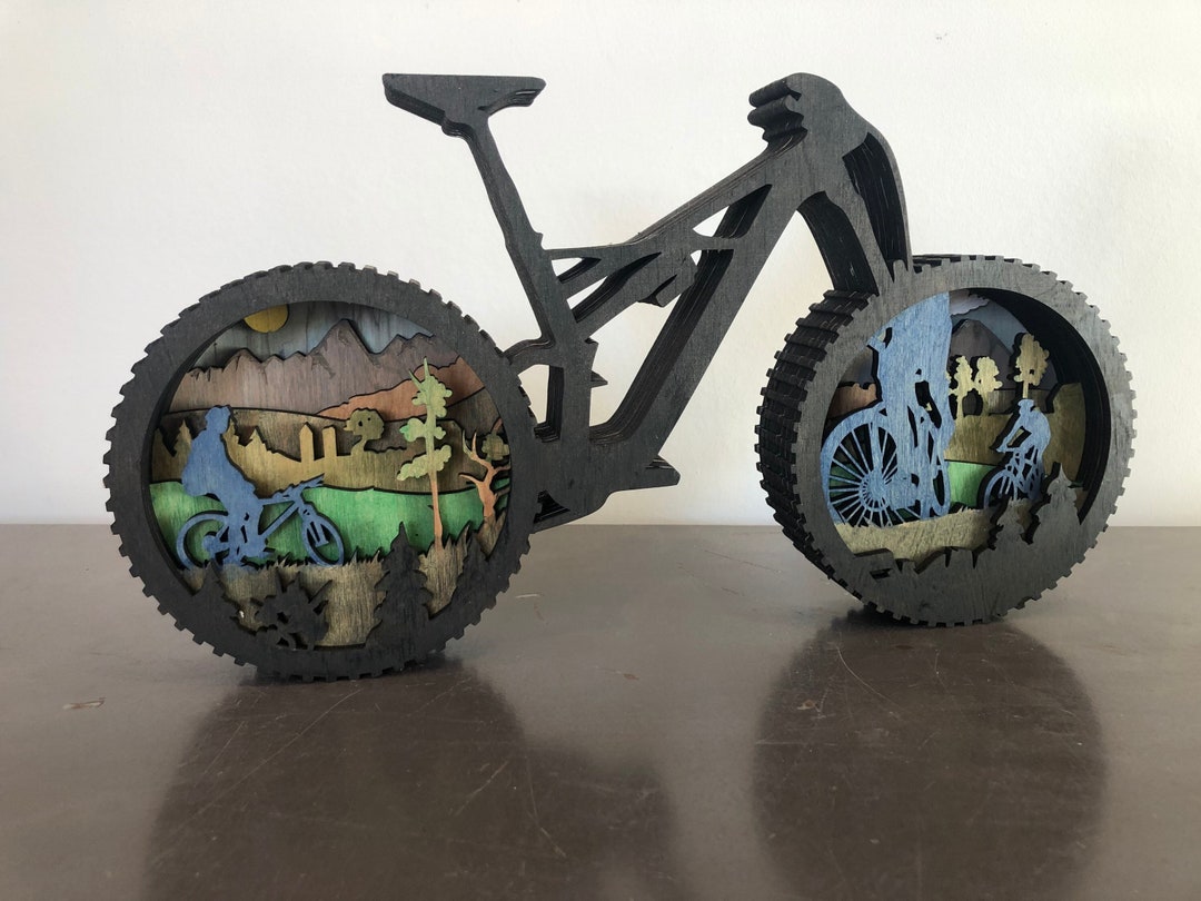3D Stained Wood Mountain Bike Scene With Mountain, Trees and Bikers ...
