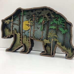 3D Stained Wood Bear Scene With Layered Trees and Birds Nested in a ...