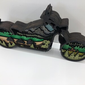 3D Stained Wood Motorcycle Scene With Mountains & Trees Nested in a ...
