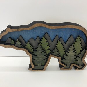 3D Stained Wood Bear Scene Mountains and Layered Trees Nested in a ...
