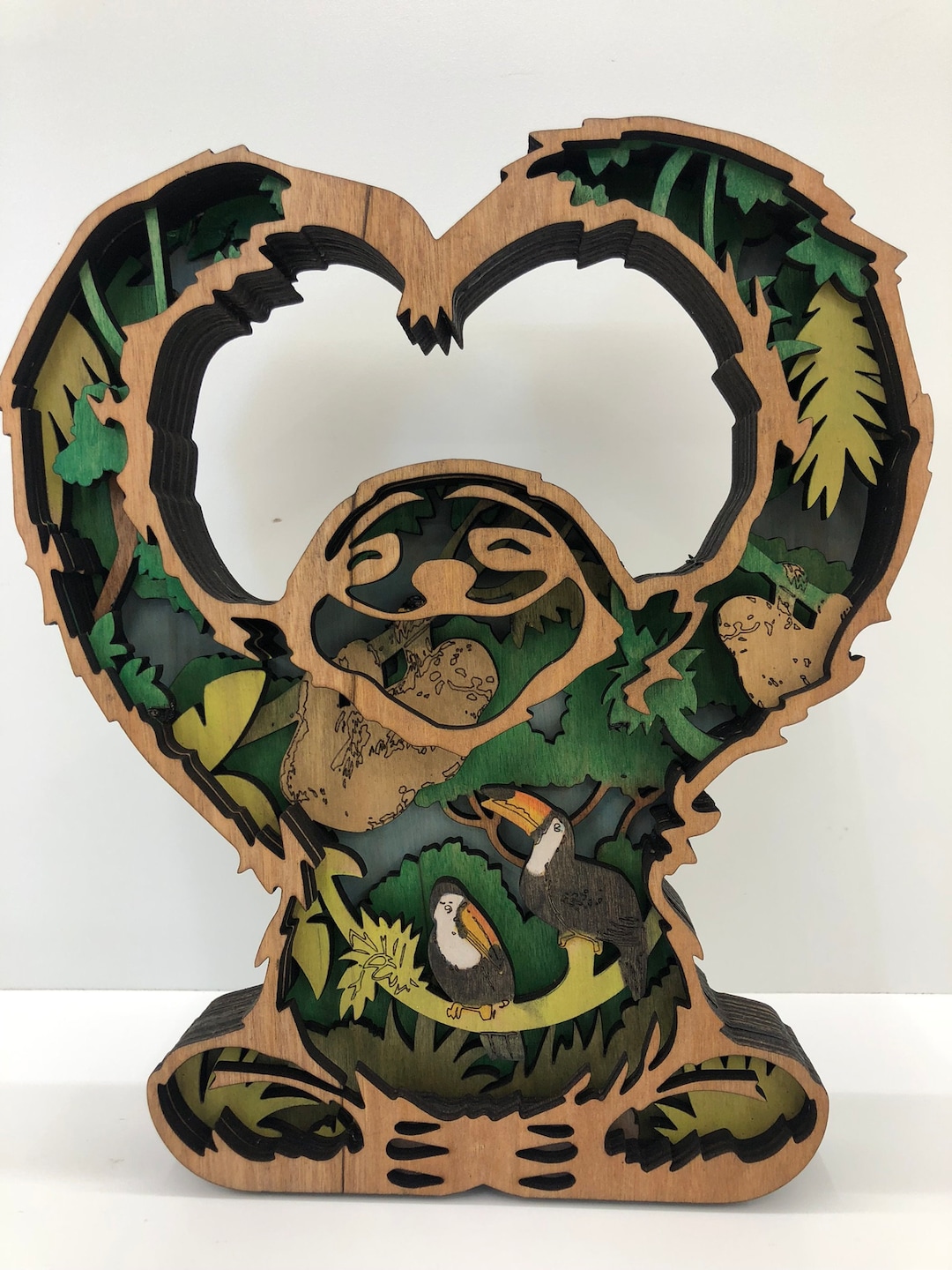 3D Stained Wood Sloth With Trees and Animals in the Rainforest Nested ...