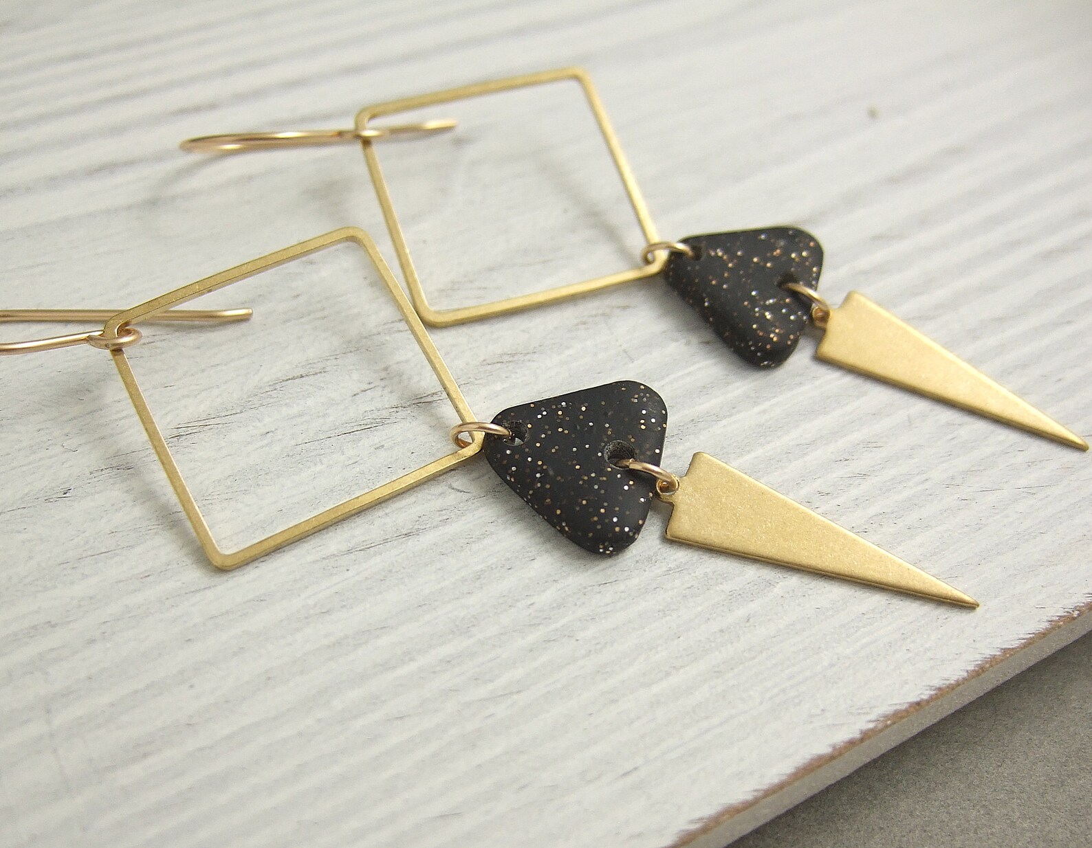 Earrings made with Triangles of Sparkly Black Polymer Clay | Etsy