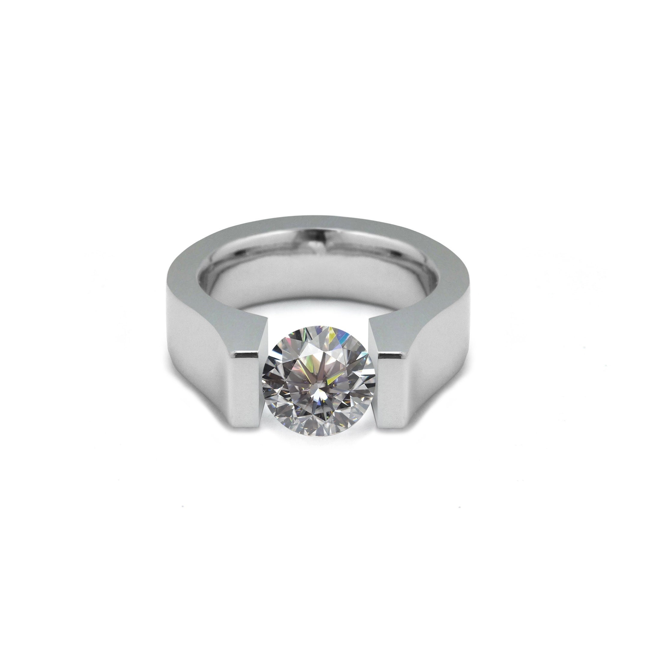 MAREA Flat high setting ring with a tension set white sapphire in ...
