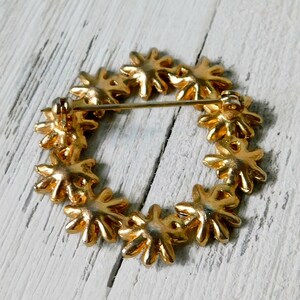 Vintage Gold Tone Circle With Flowers and Ruby Red Rhinestones Brooch ...