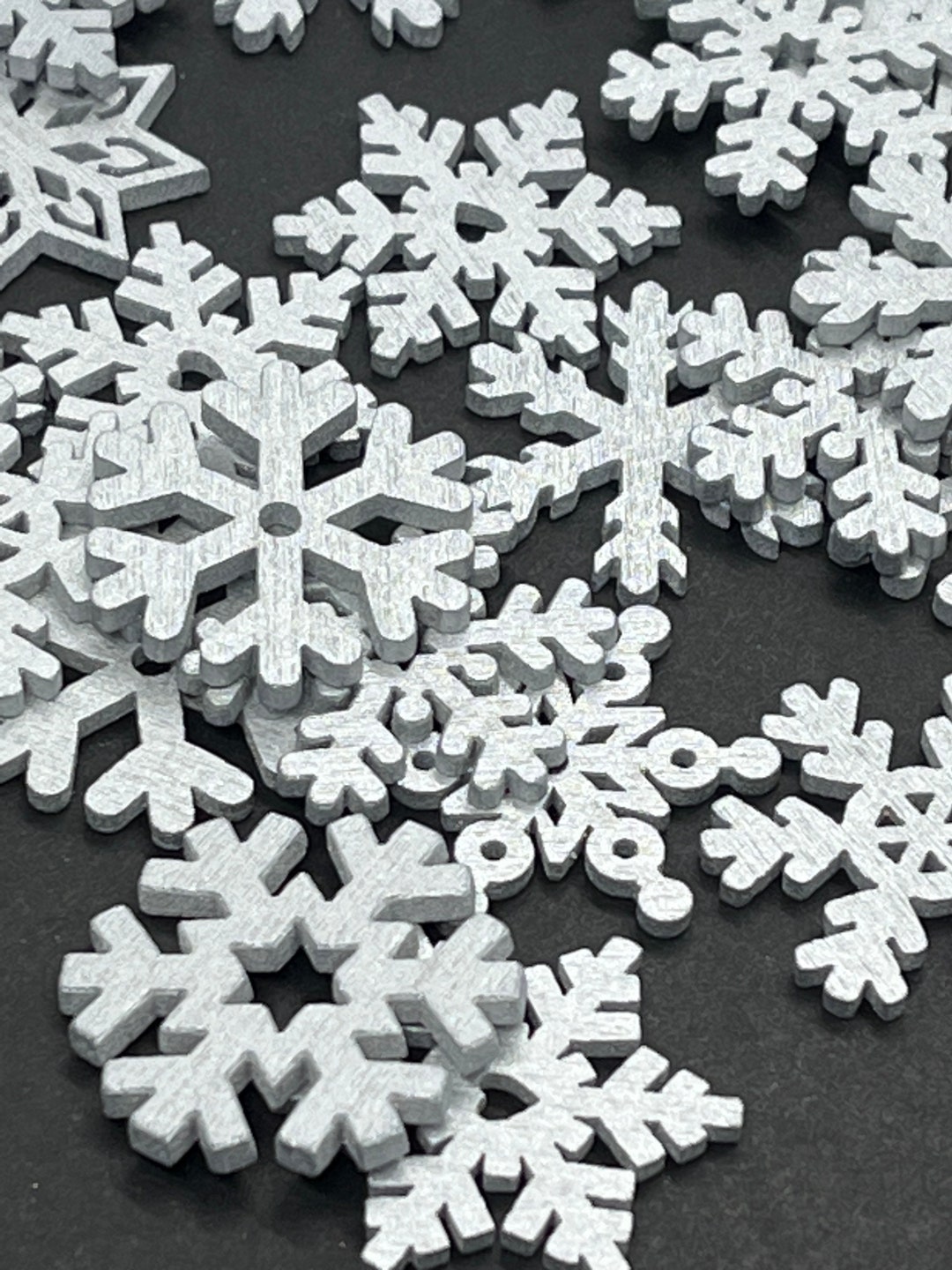 Silver Coloured Wooden Snowflake Shapes. Available in Packs of 15 and ...