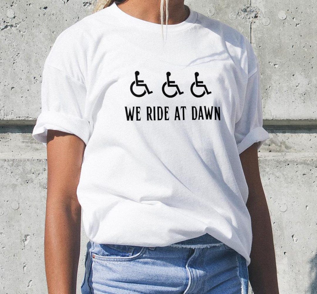Funny Wheelchair Parking Symbol we Ride at Dawn Unisex Shirt, Funny ...