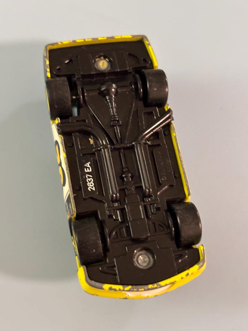 Disney Pixar Cars Claude Scruggs #52 Leak Less Yellow Die-cast Vehicle ...