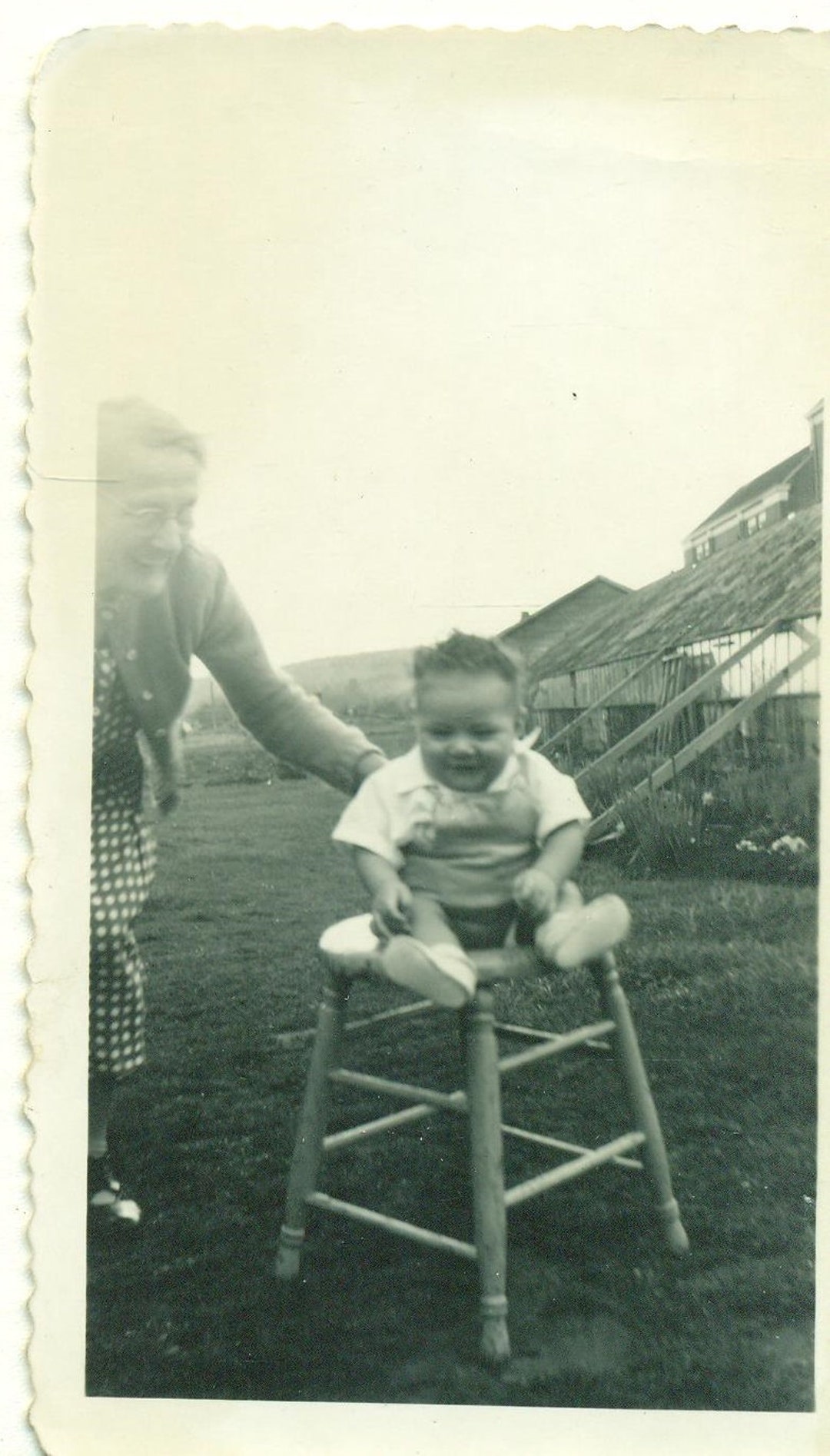 Trying to Get a Baby Picture Grandma Holding Moving Boy on Stool Farm ...